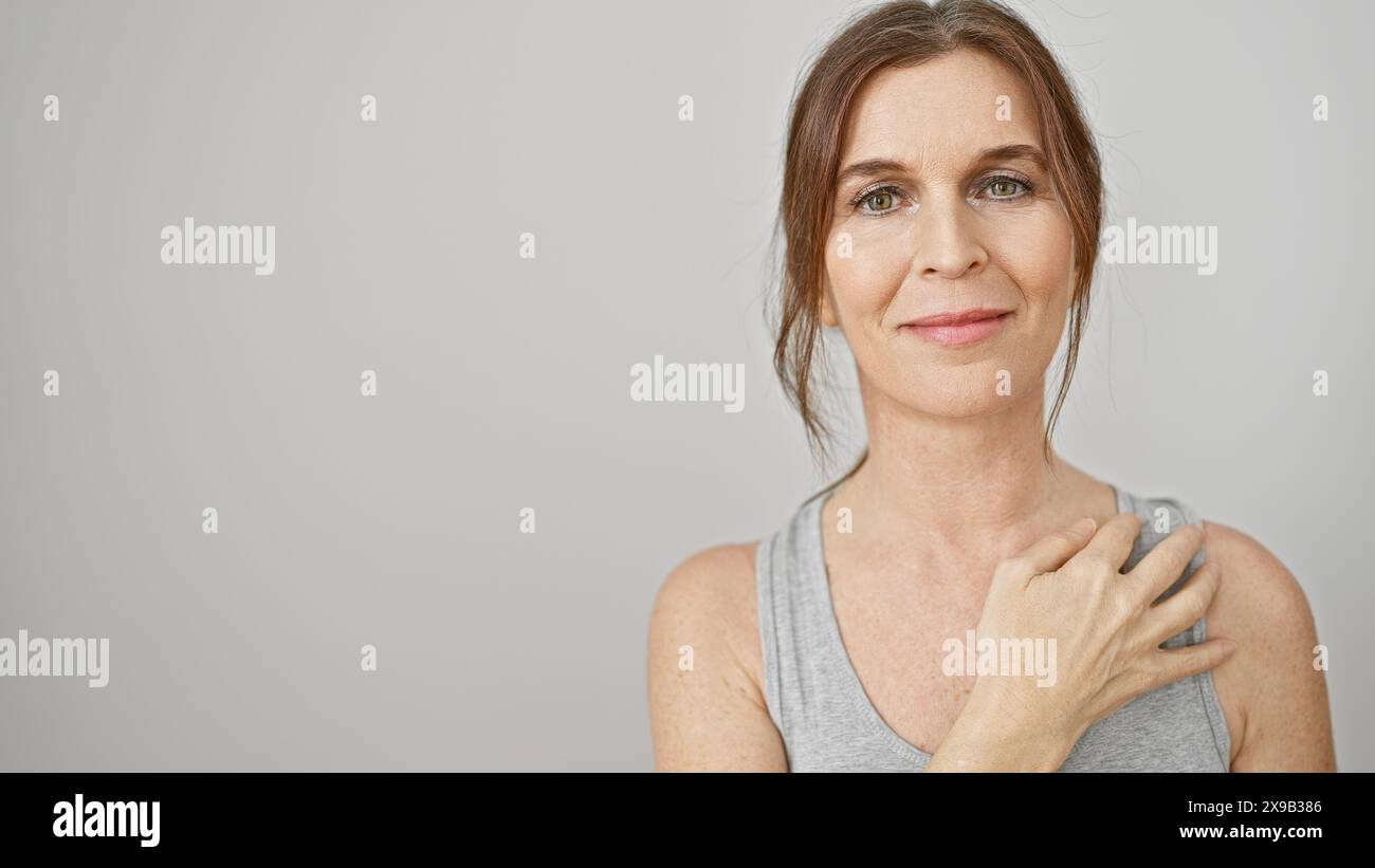 Portrait of a confident middle-aged woman with short hair against a ...