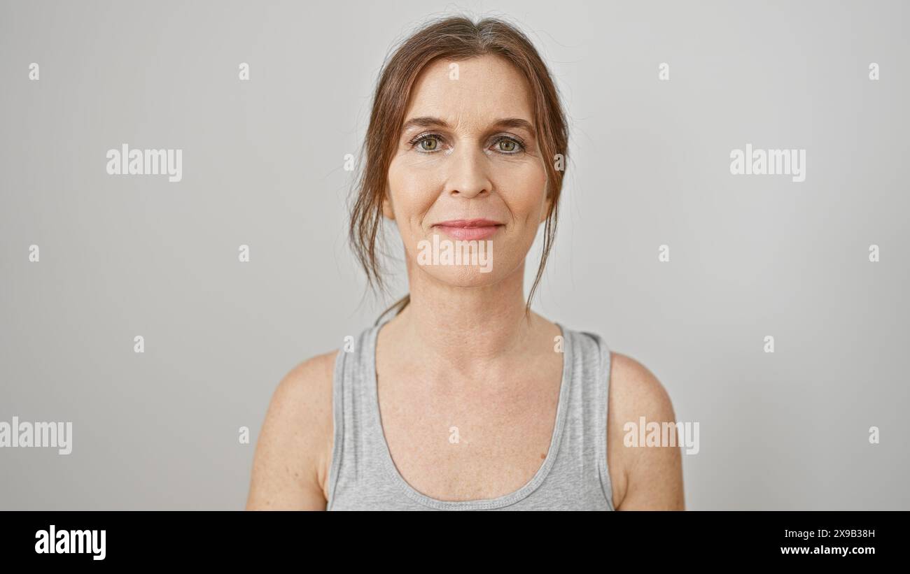 Portrait of a confident middle-aged woman with short hair against a ...