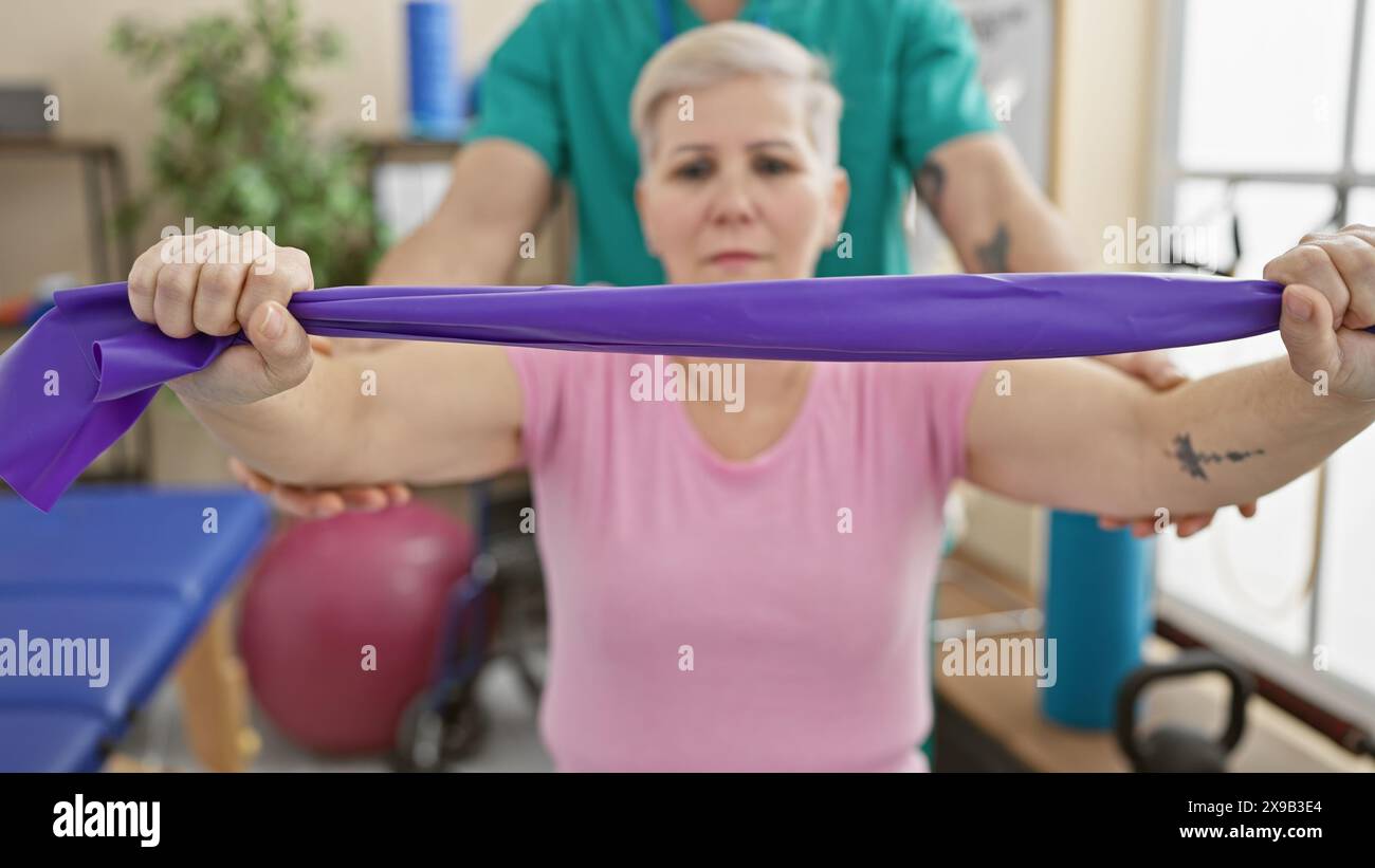 Senior patient performs resistance band hi-res stock photography and ...