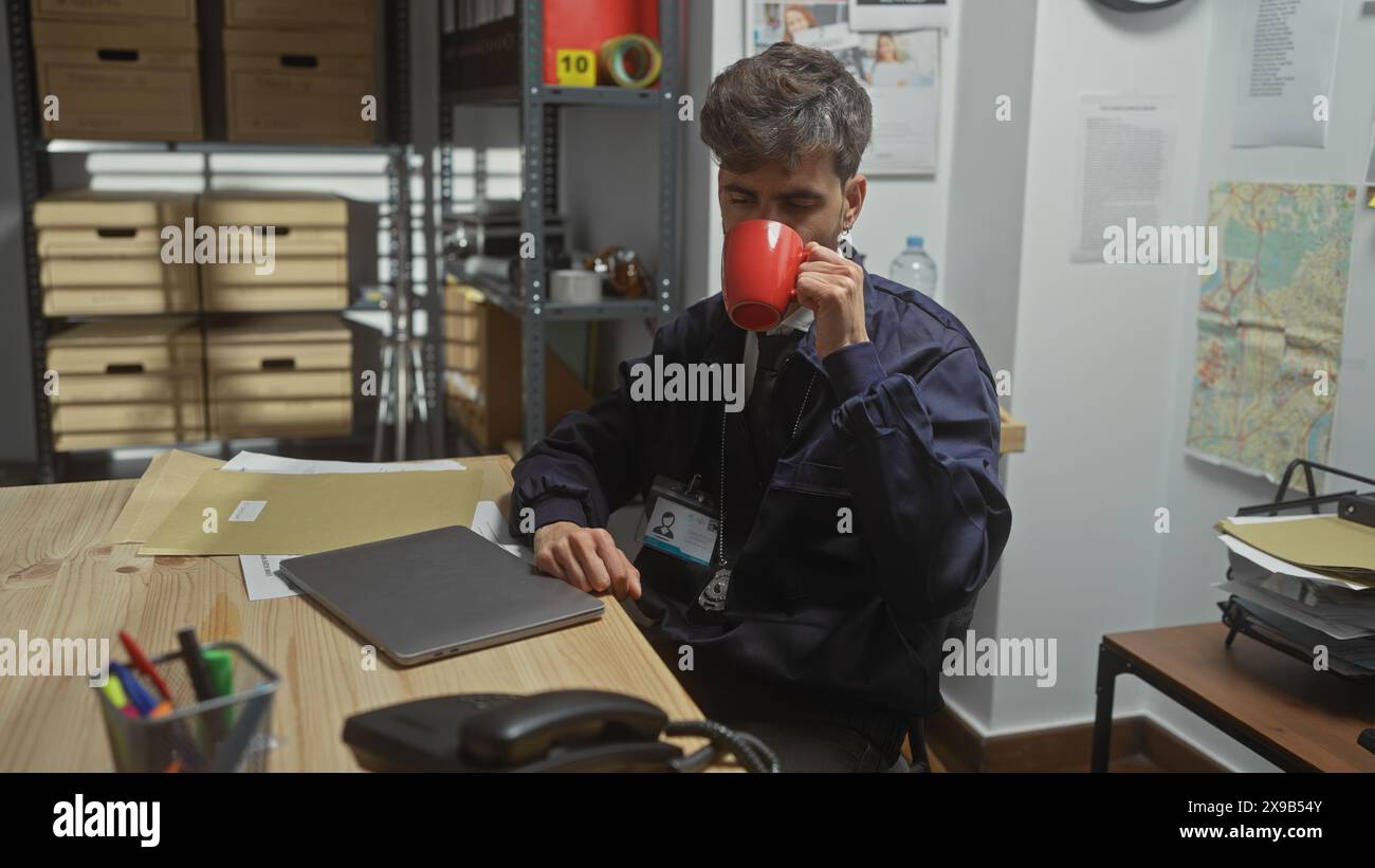 Hispanic detective enjoys coffee break in cluttered police station ...