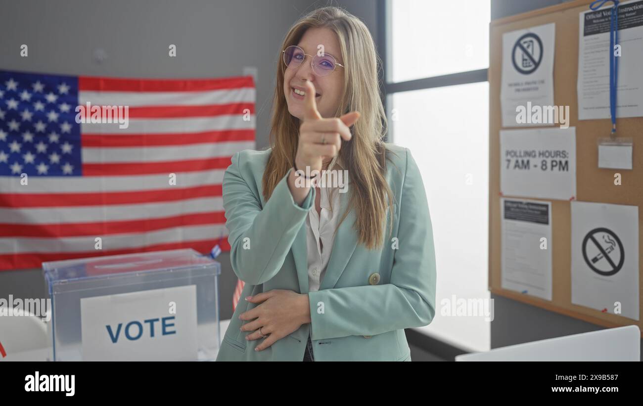 A young woman pointing and smiling in an american electoral college ...