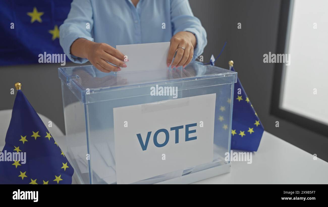 A woman casts her ballot in a european-themed indoor polling station ...
