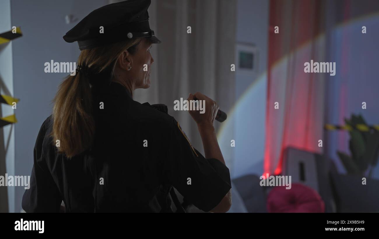 Blonde woman police officer investigating a crime scene inside a modern ...