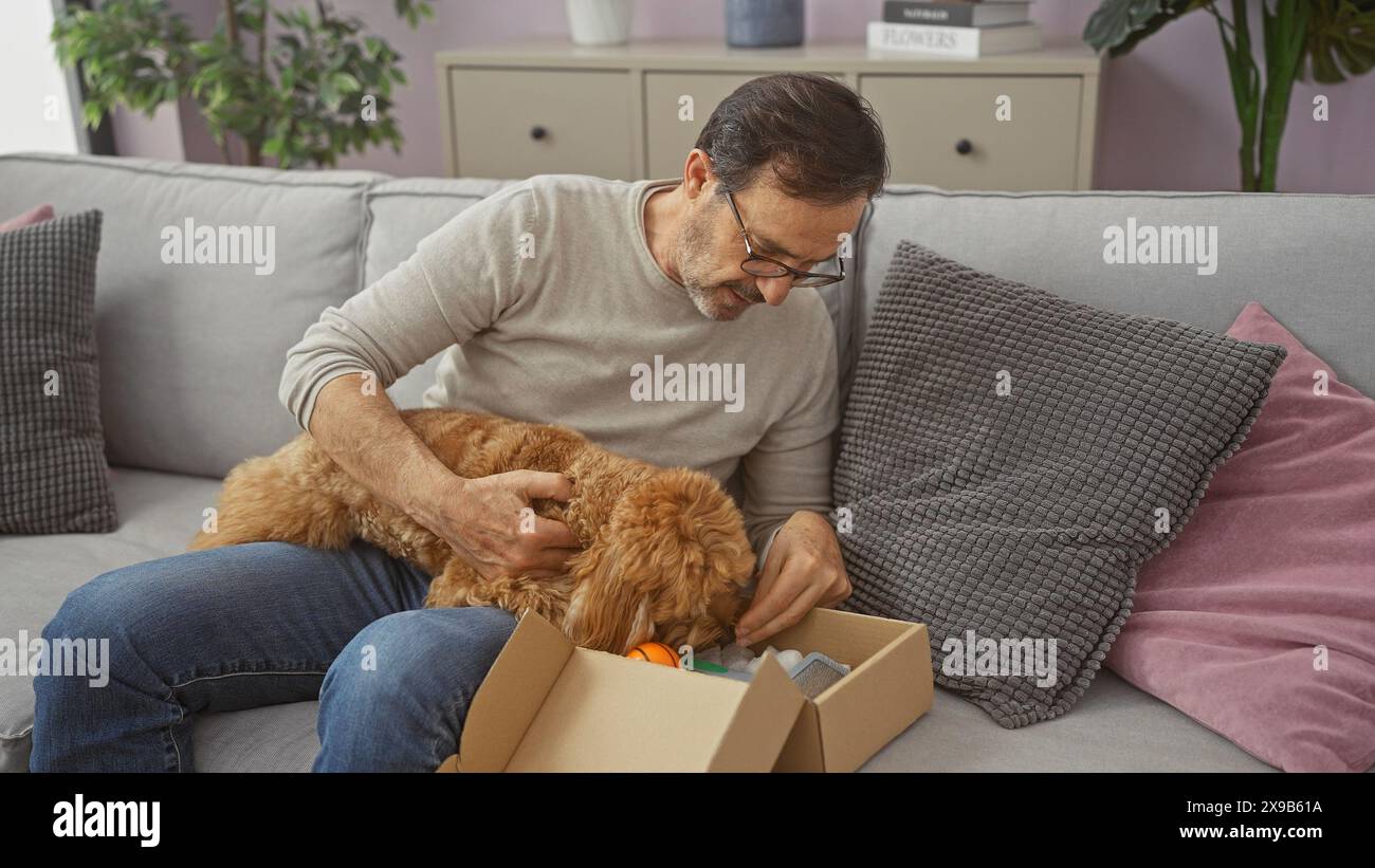 A middle-aged hispanic man bonds with his poodle in a cozy living room ...