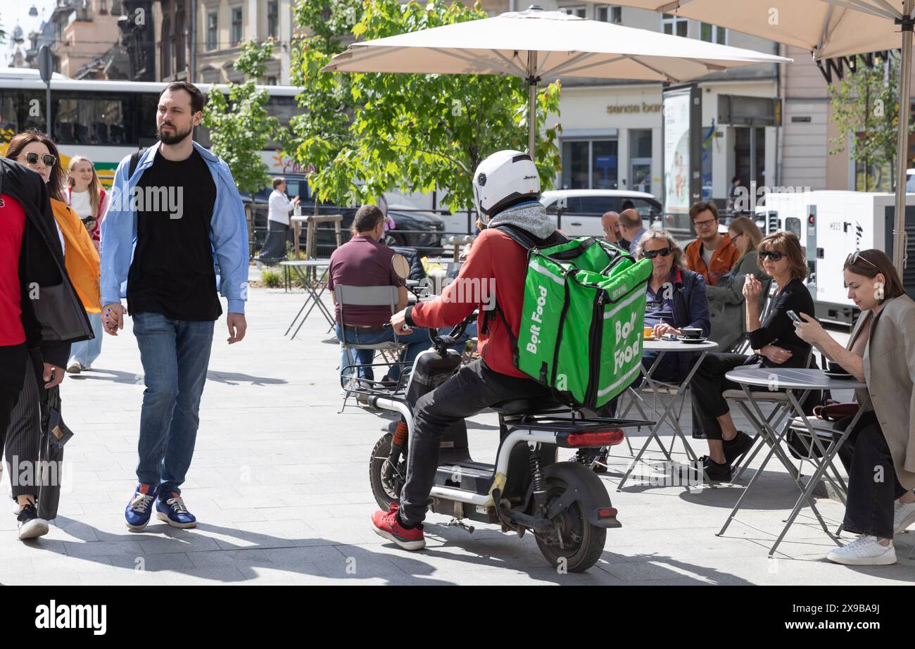 A Bolt food delivery courier is seen rushing to customers on his ...