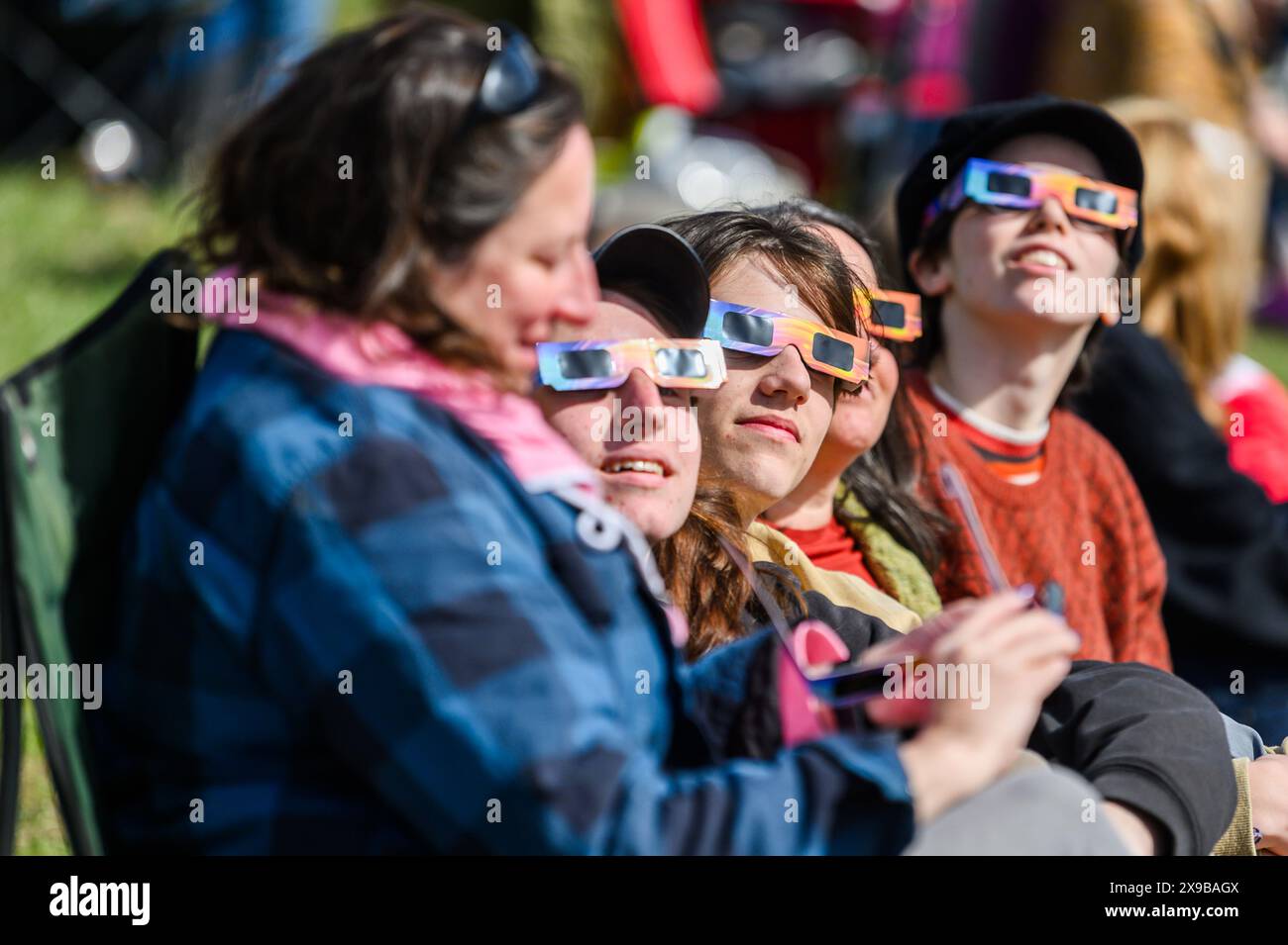 Viewers watch the solar eclipse of 2024 from the lawn of the Vermont ...