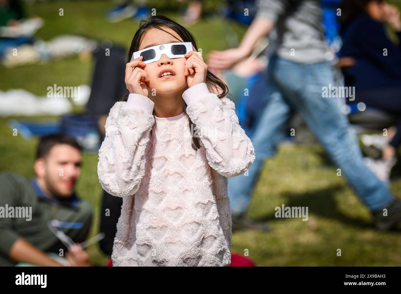 Viewers watch the solar eclipse of 2024 from the lawn of the Vermont ...
