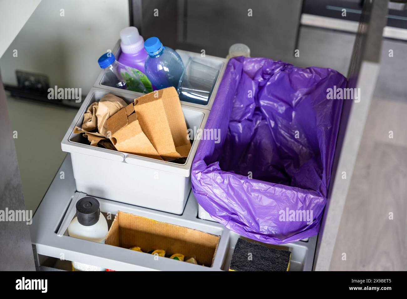 Household bins for waste sorting in the kitchen for recycle. Plastic ...