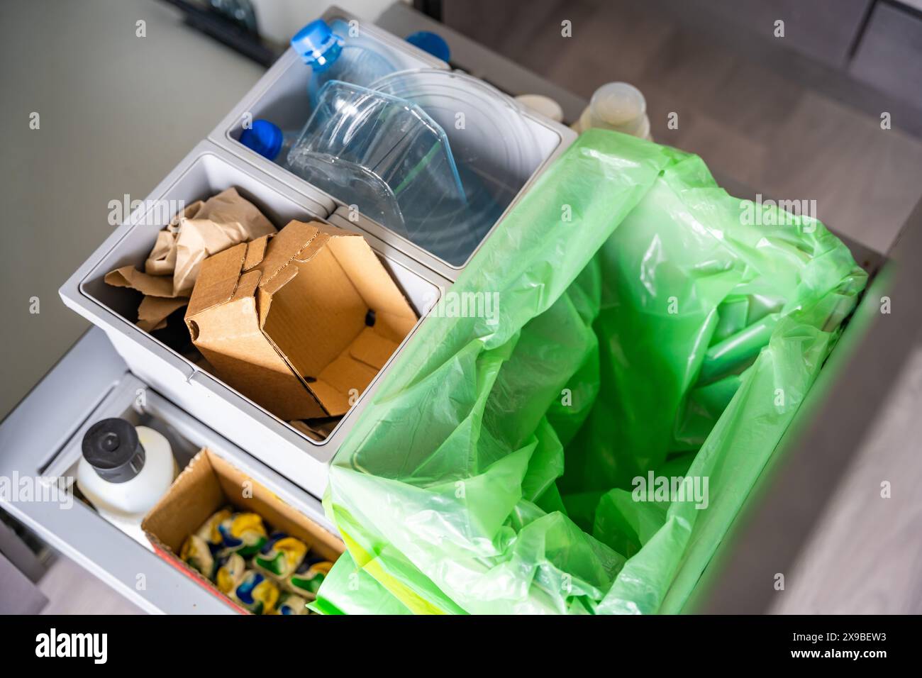 Household bins for waste sorting in the kitchen for recycle. Plastic ...