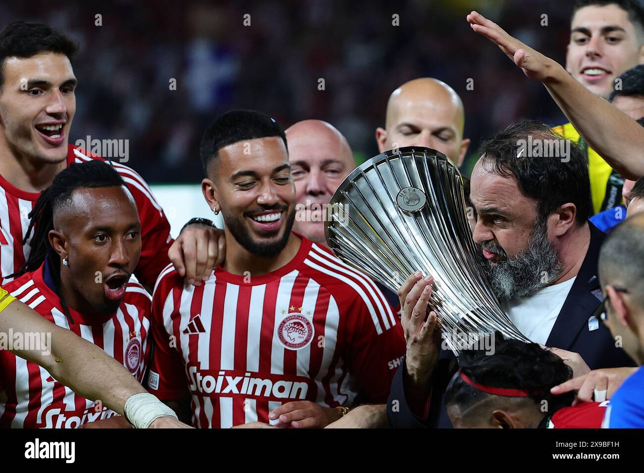 Olympiacos president Evangelos Marinakis lifts the trophy at the end of the 2023/2024 Conference ...