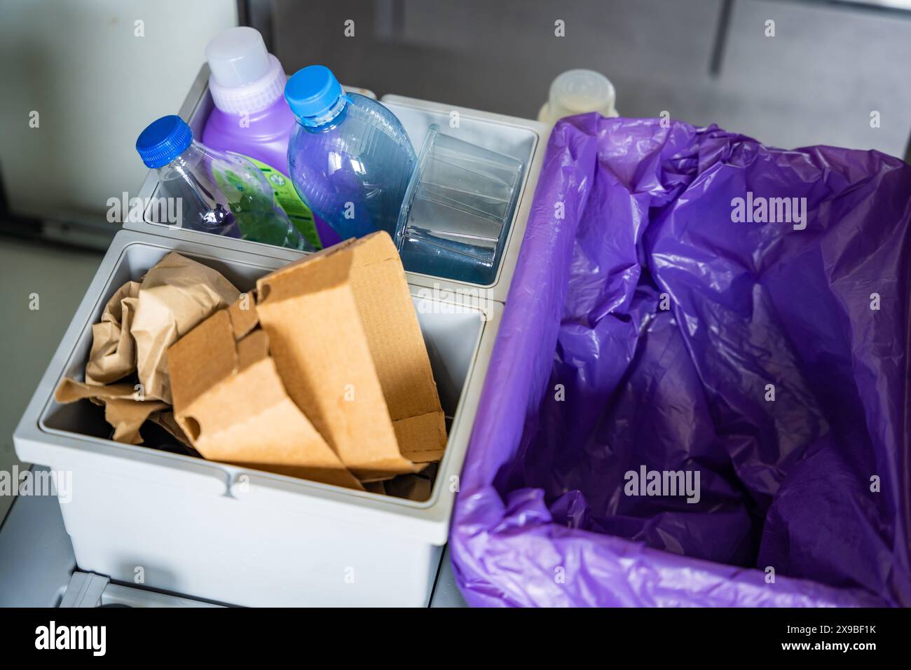 Household bins for waste sorting in the kitchen for recycle. Plastic ...