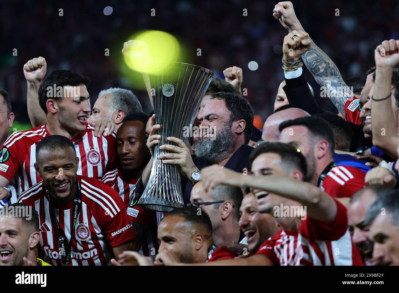Olympiacos president Evangelos Marinakis lifts the trophy at the end of ...