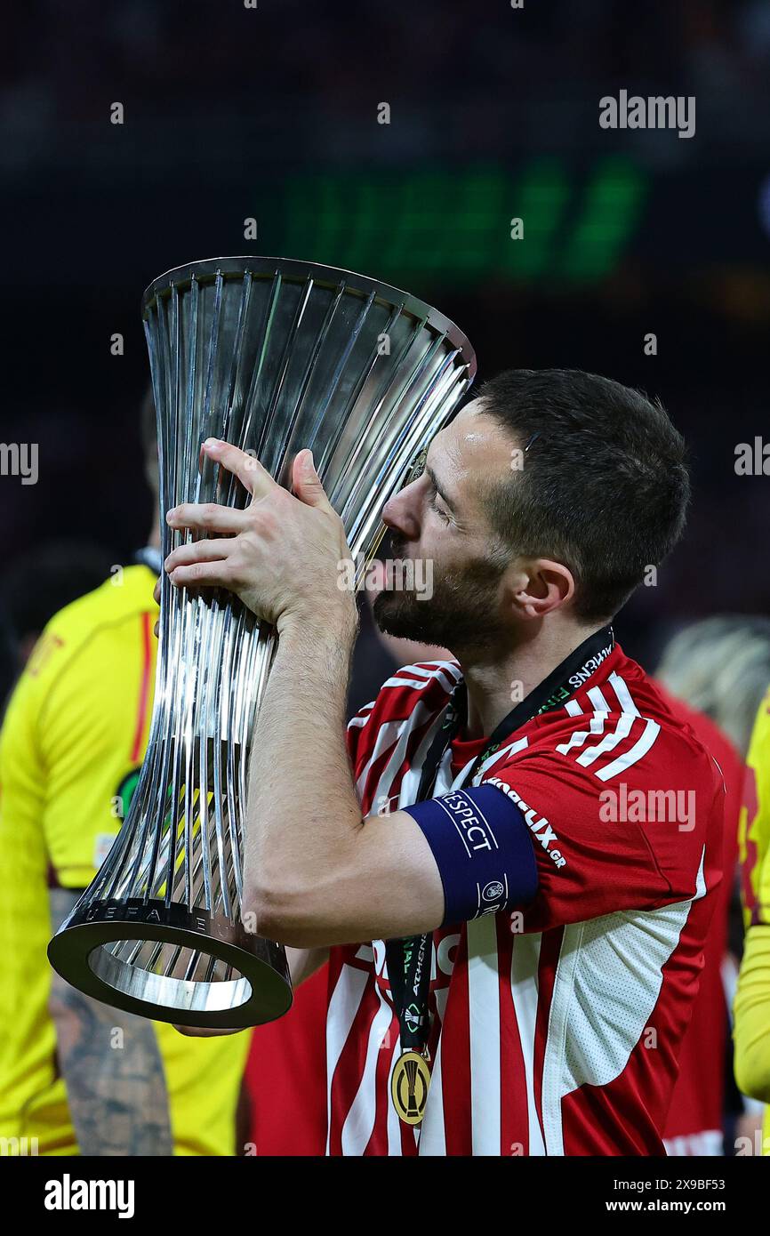 Kostas Fortounis of Olympiacos FC celebrates with the trophy at the end ...