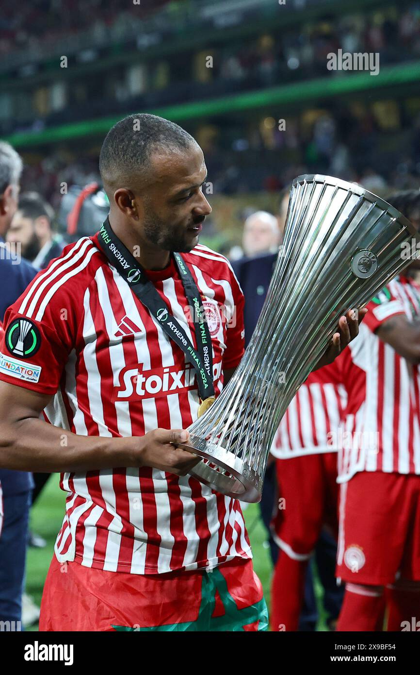 Ayoub El Kaabi of Olympiacos FC celebrates with the trophy at the end ...