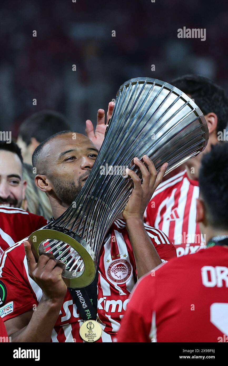 Ayoub El Kaabi of Olympiacos FC celebrates with the trophy at the end ...