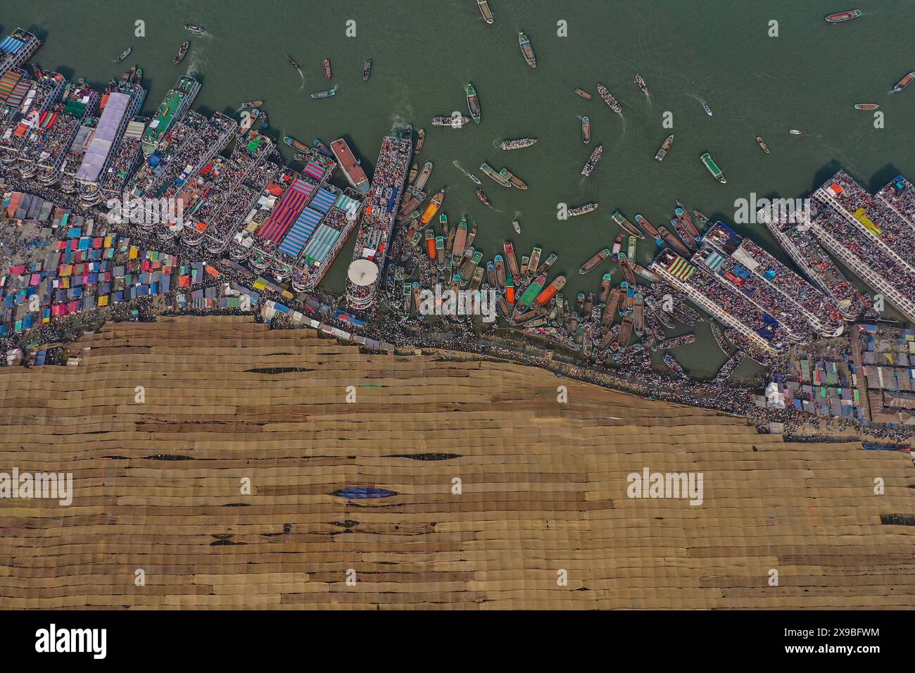 Devotees crowd the rooftops of vessels as they journey to attend the ...