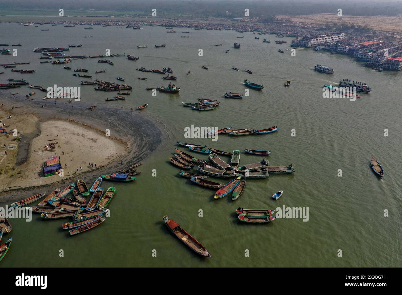 Devotees crowd the rooftops of vessels as they journey to attend the ...