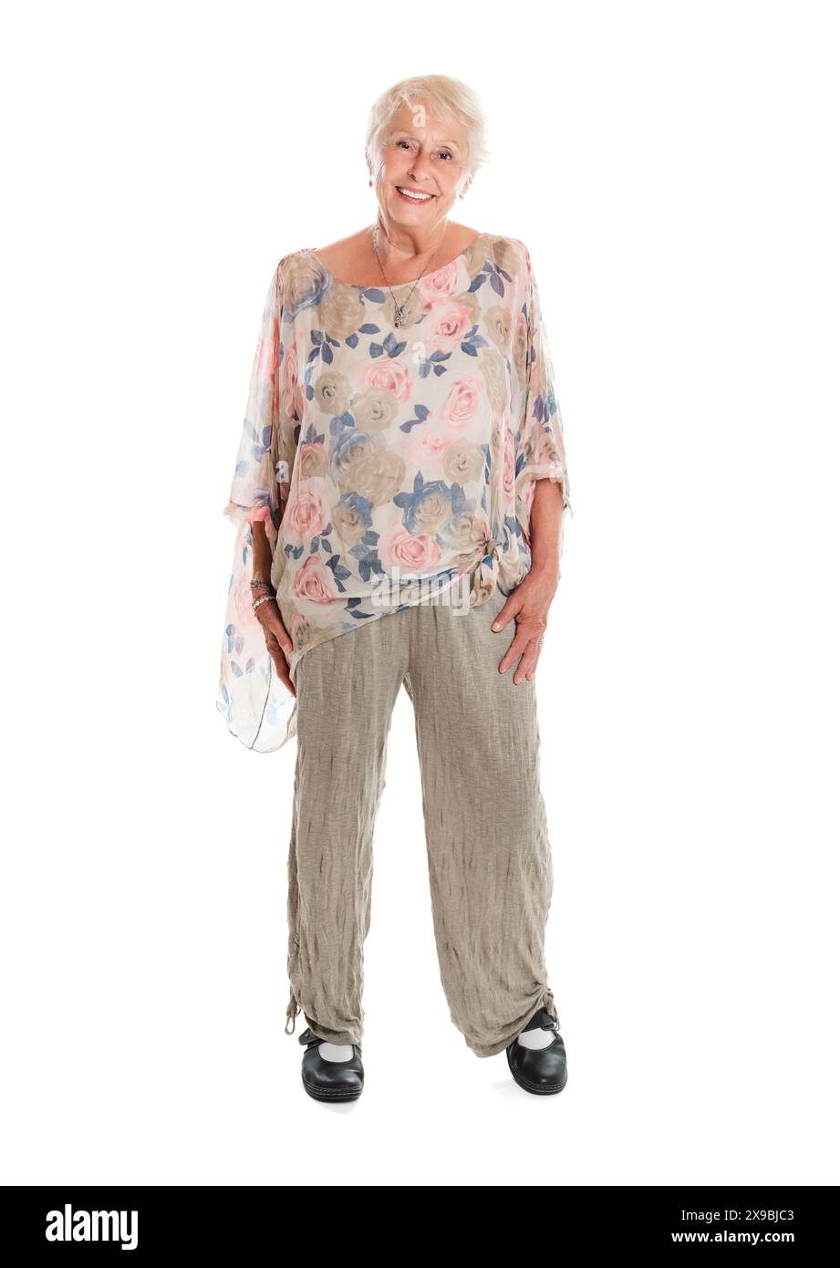 smiling retired senior woman looking at camera isolated on white ...