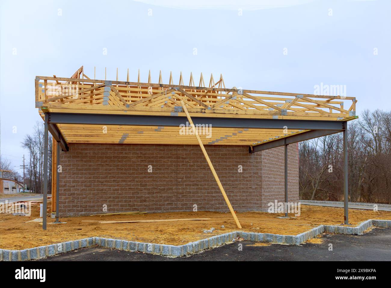 Interior of newly constructed house with wood stud framing supports ...