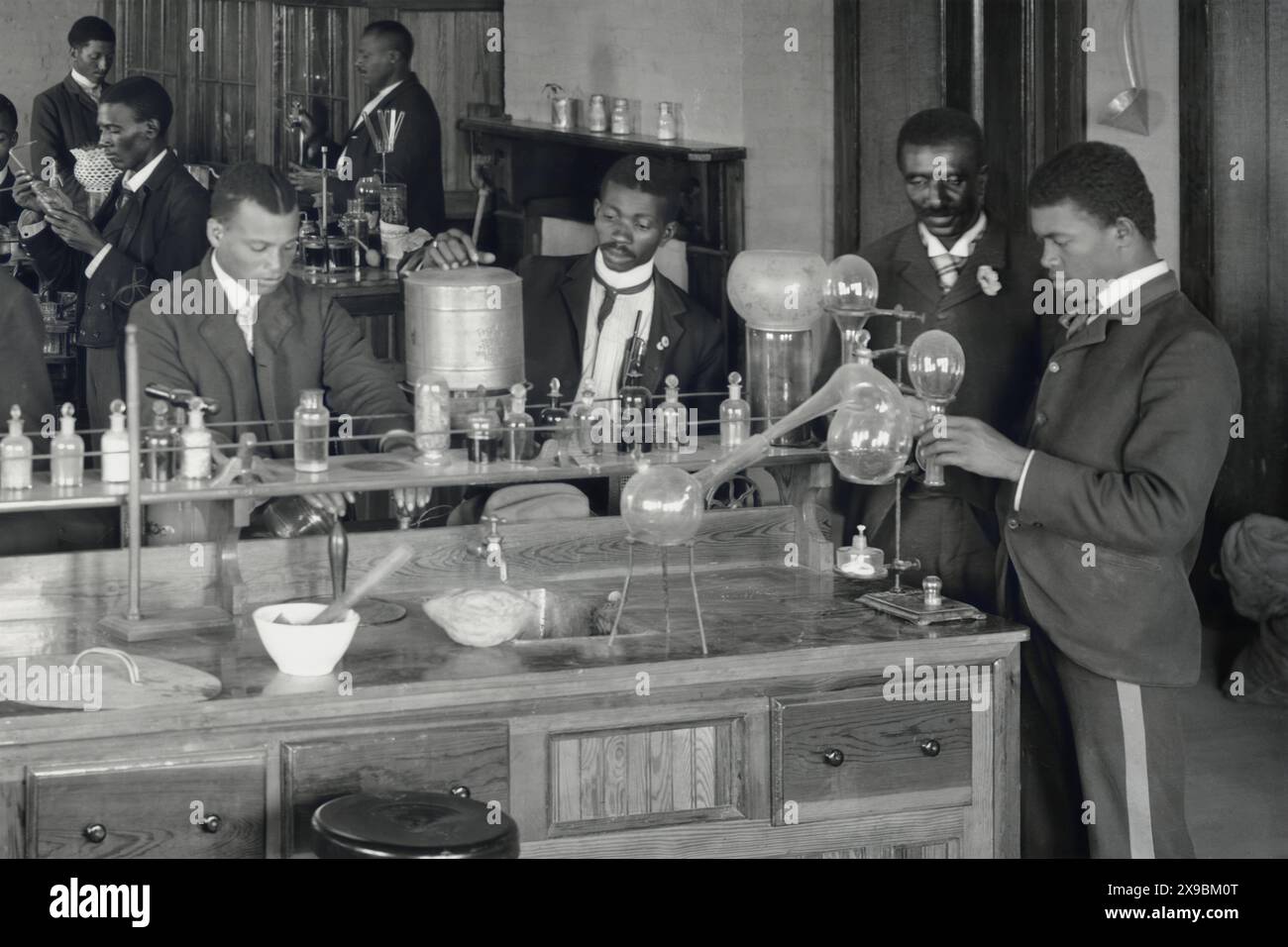 George Washington Carver (2nd from right) teaching students in the ...