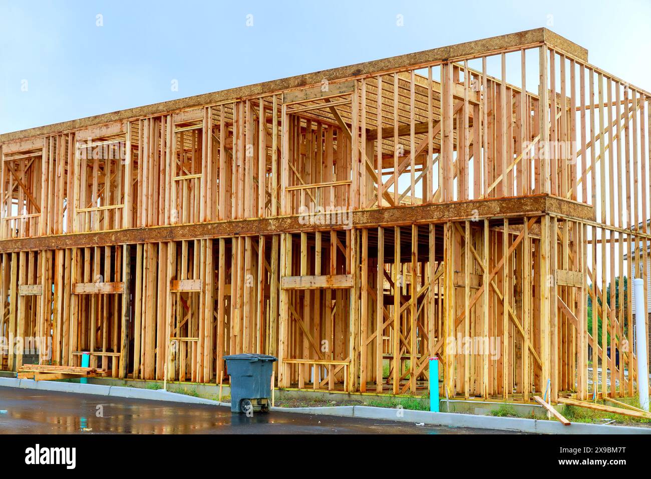 Beam is supported by wooden stud timber framing in an unfinished ...