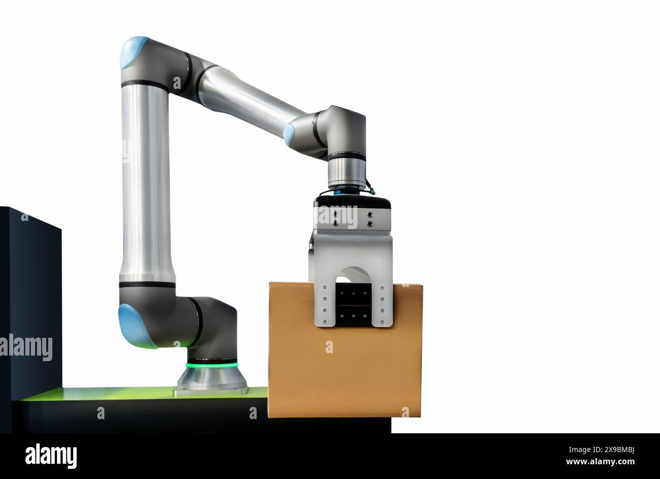 Isolated robotic arm picking and place cardboard box. Robotic material handling Stock Photo - Alamy