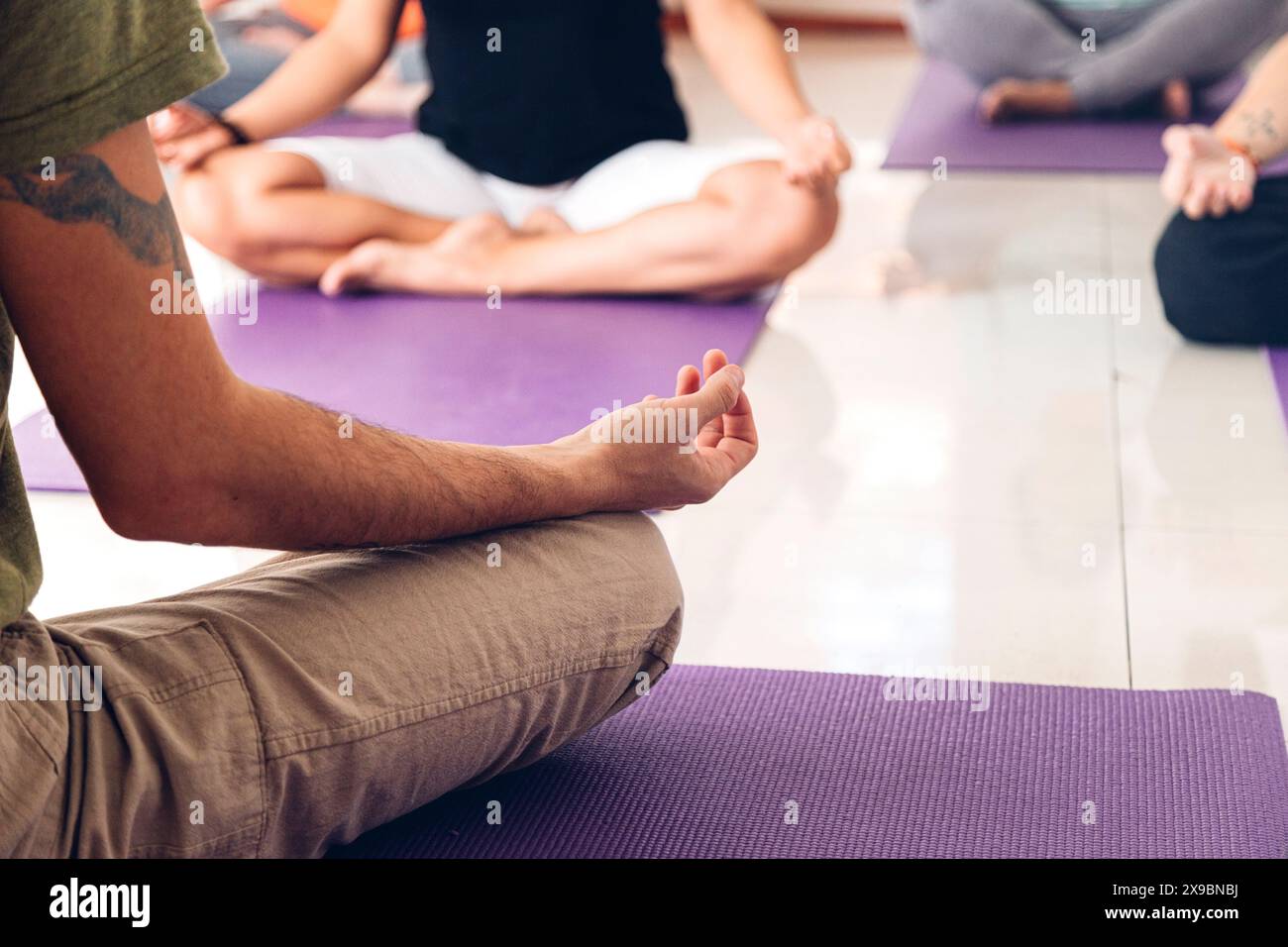 Yogi people practice yoga in lotus position. Meditation in group Stock ...