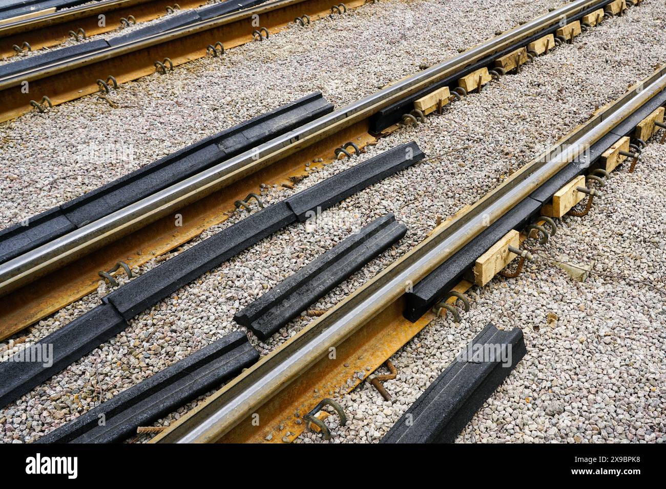 Attaching black polyurethane pads to new tram rails to reduce vibration ...