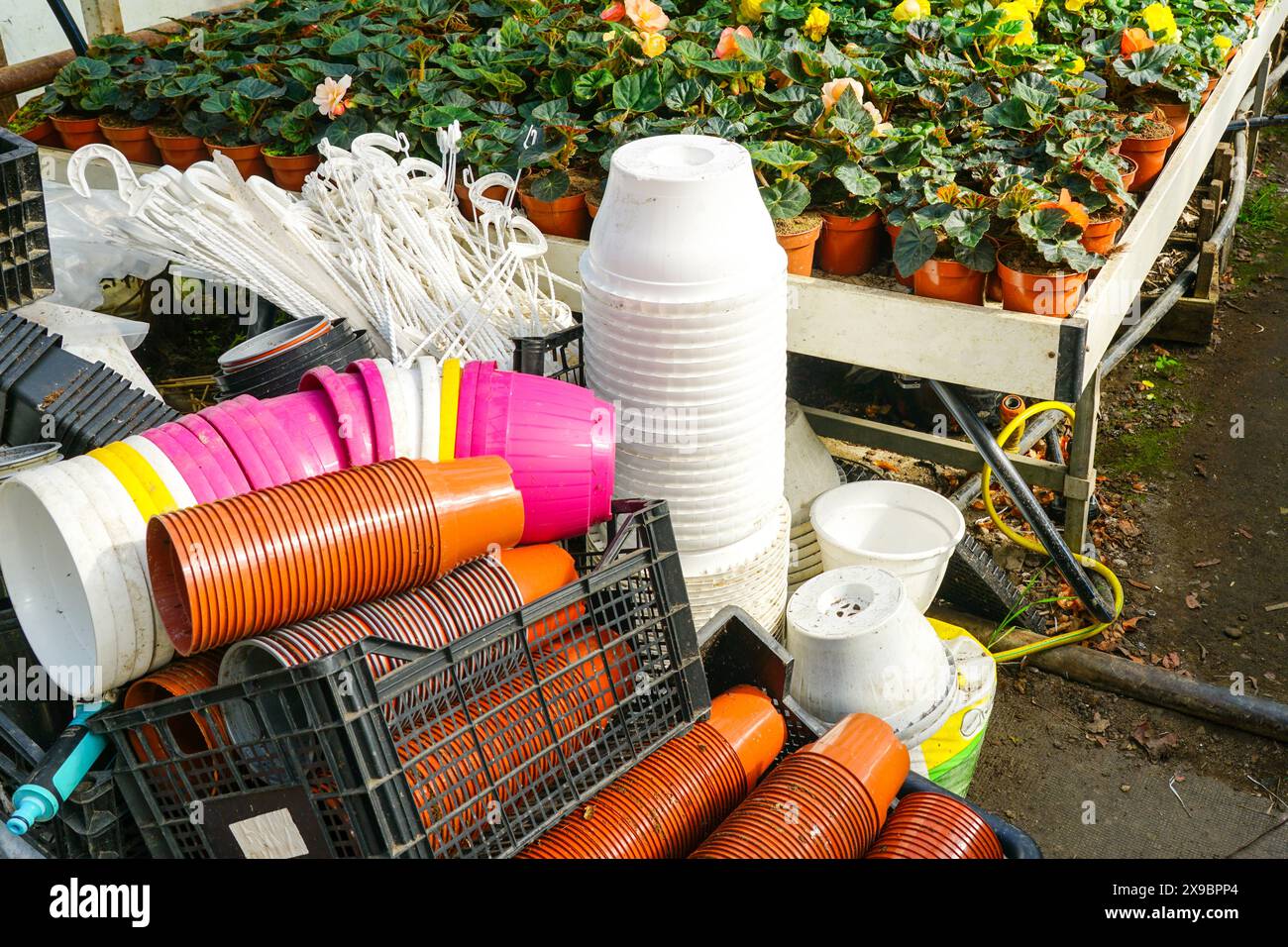 New and used plastic flower pots and baskets pile of different sizes ...