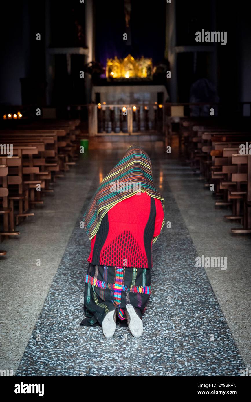 Mayan woman walking on her knees towards the altar, Catholic Church ...