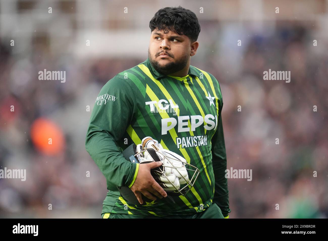 Pakistan’s Azam Khan walks back to the changing rooms after losing his ...