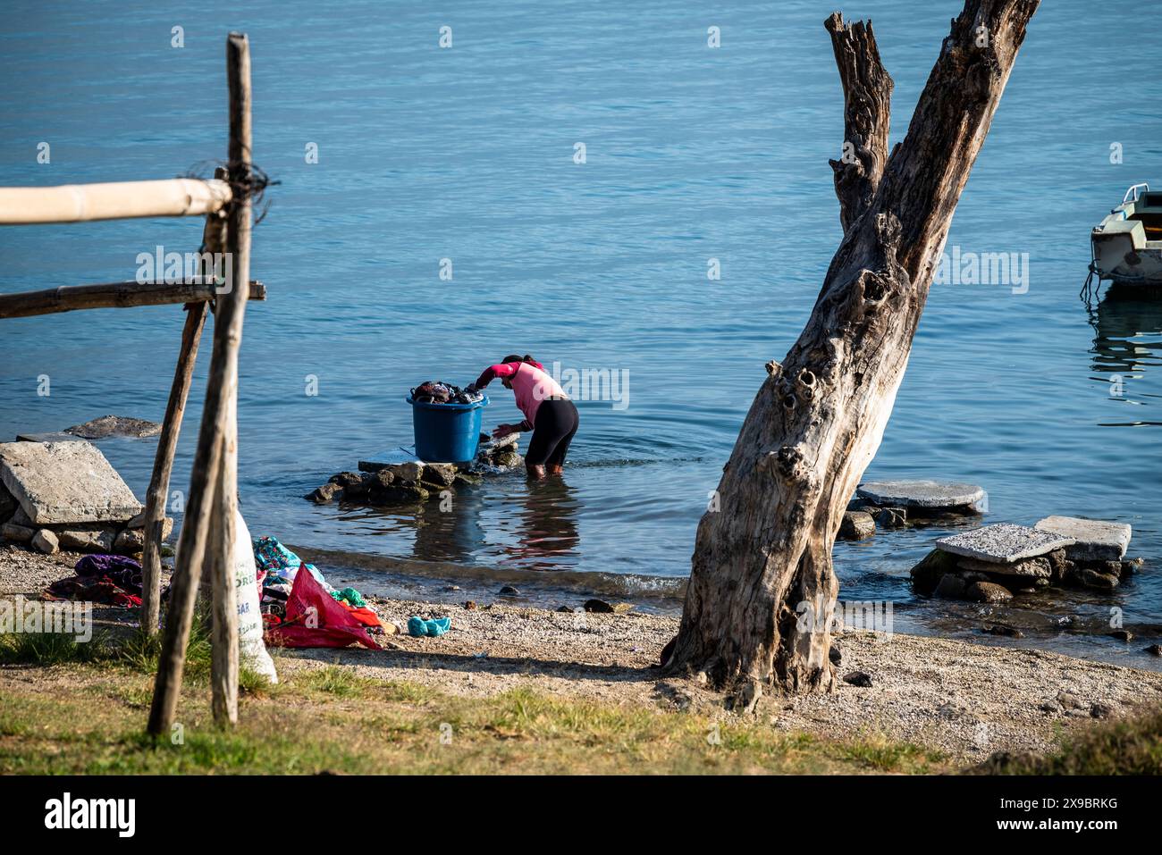 Woman washing clothes in the lake, San Pedro La Laguna, Lake Atitlan ...