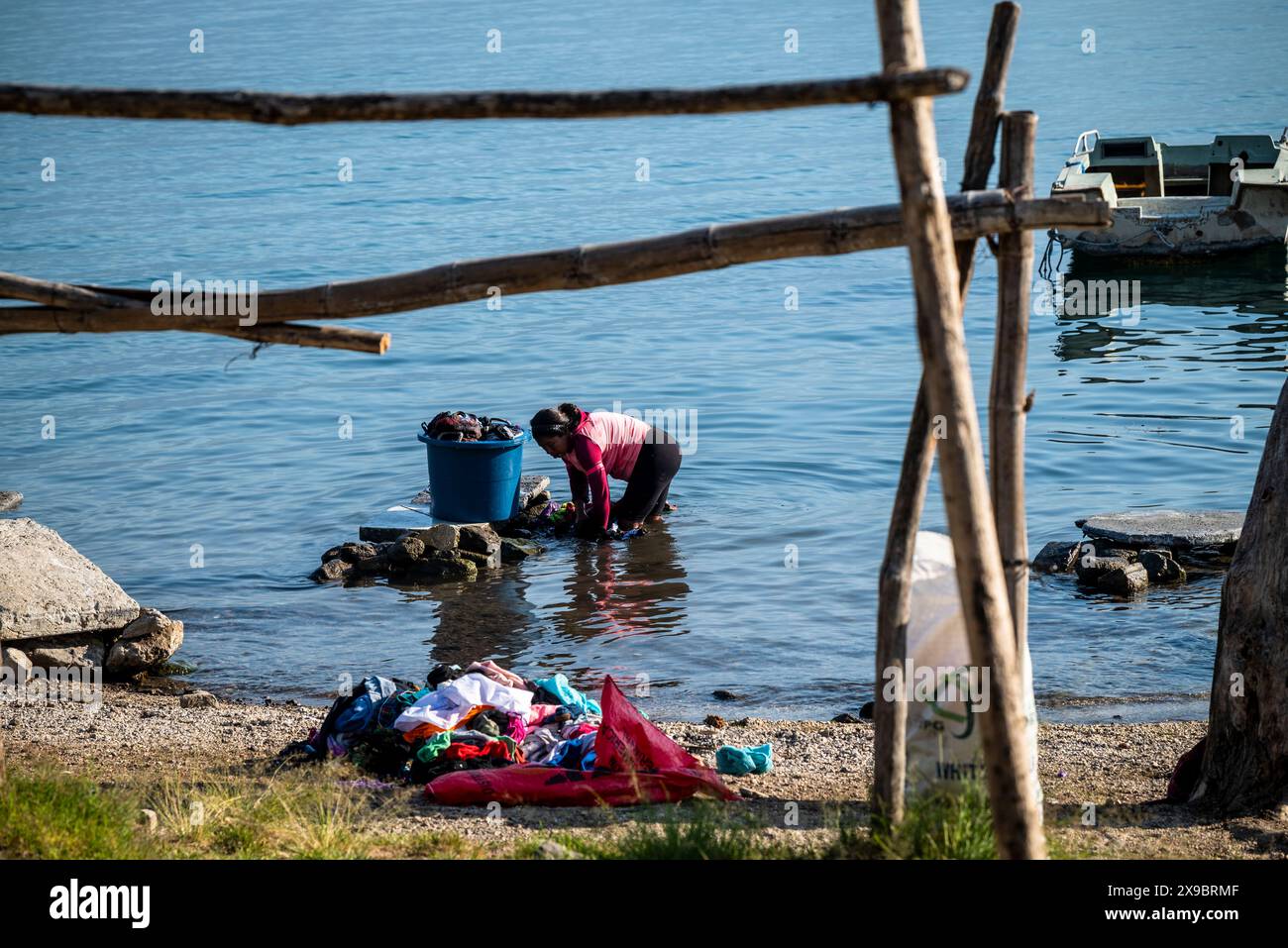 Woman washing clothes in the lake, San Pedro La Laguna, Lake Atitlan ...
