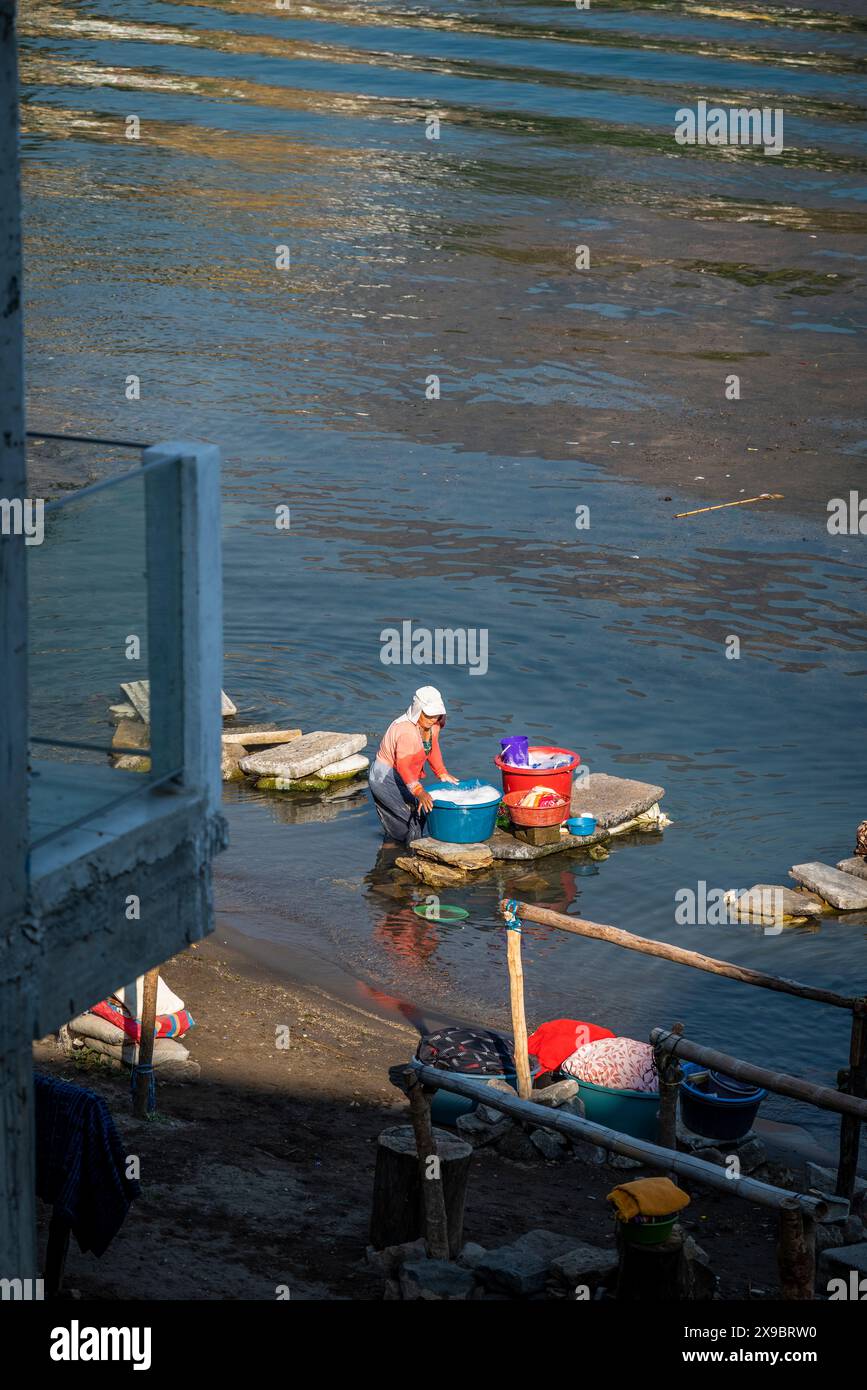 Woman washing clothes in the lake, San Pedro La Laguna, Lake Atitlan ...