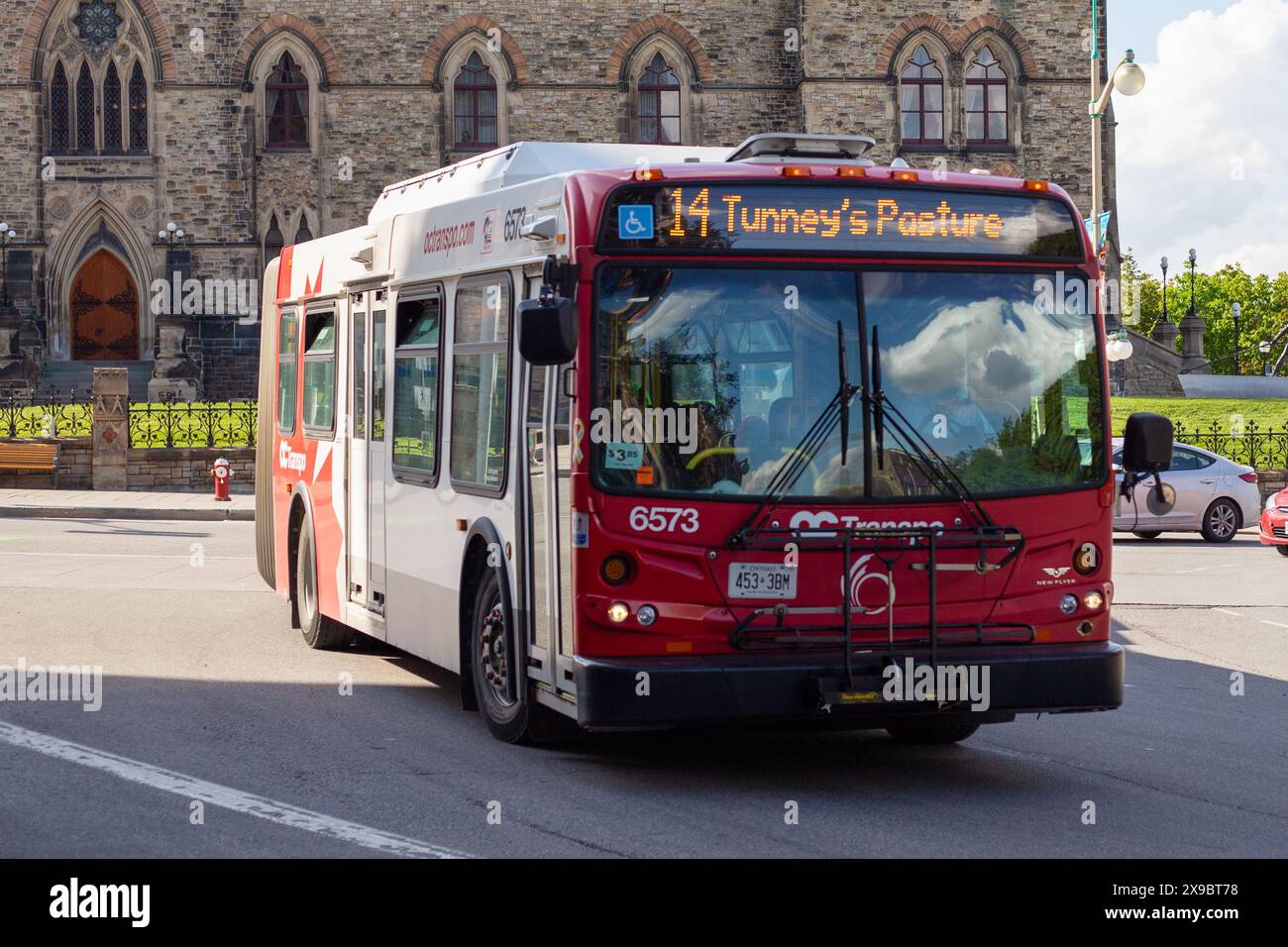 Public bus on the road in downtown near Parliament building. OC Transpo ...