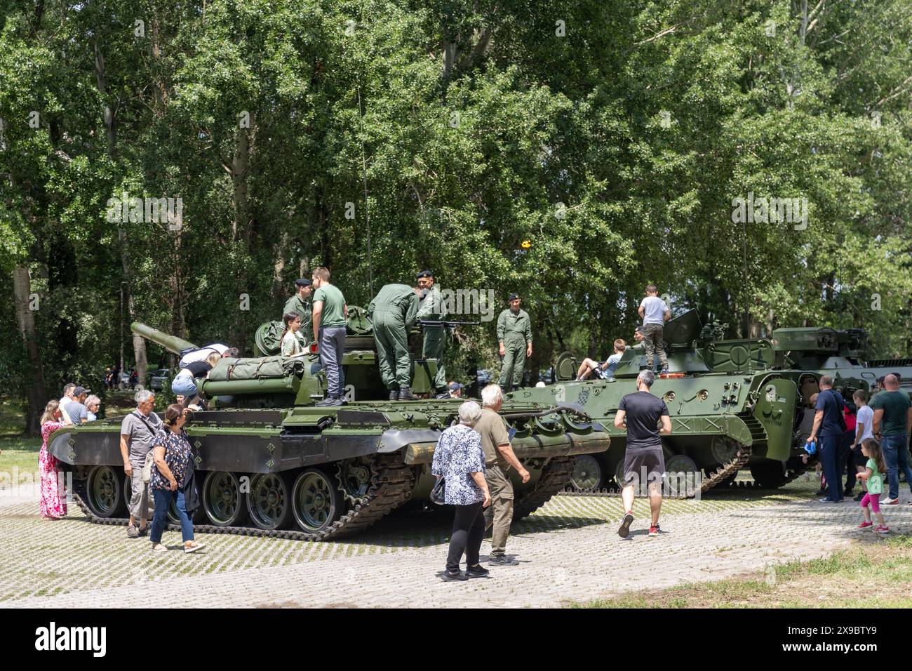 Osijek, Croatia. 30th May, 2024. People are looking at the military ...