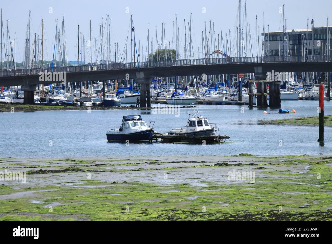 Gosport, Hampshire, England. 17 May 2024. Two small boats, tethered to ...