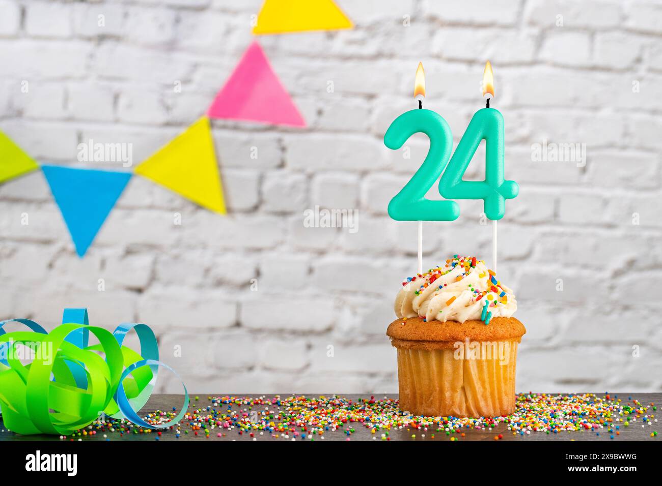 Green birthday candle - Candle number 24 Stock Photo - Alamy