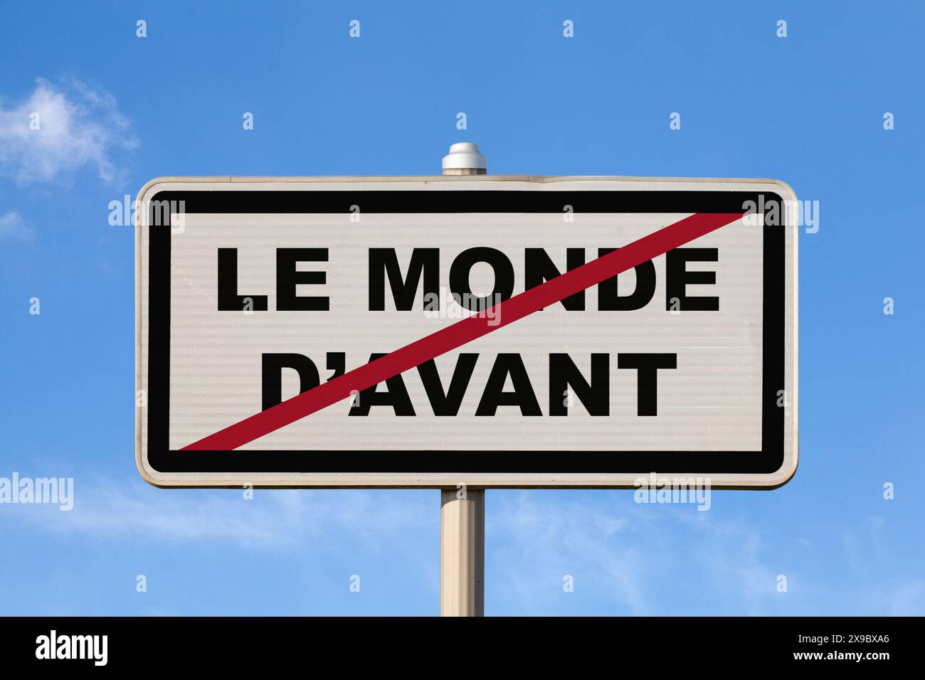 A French exit city sign against a blue sky with written in French "Le ...