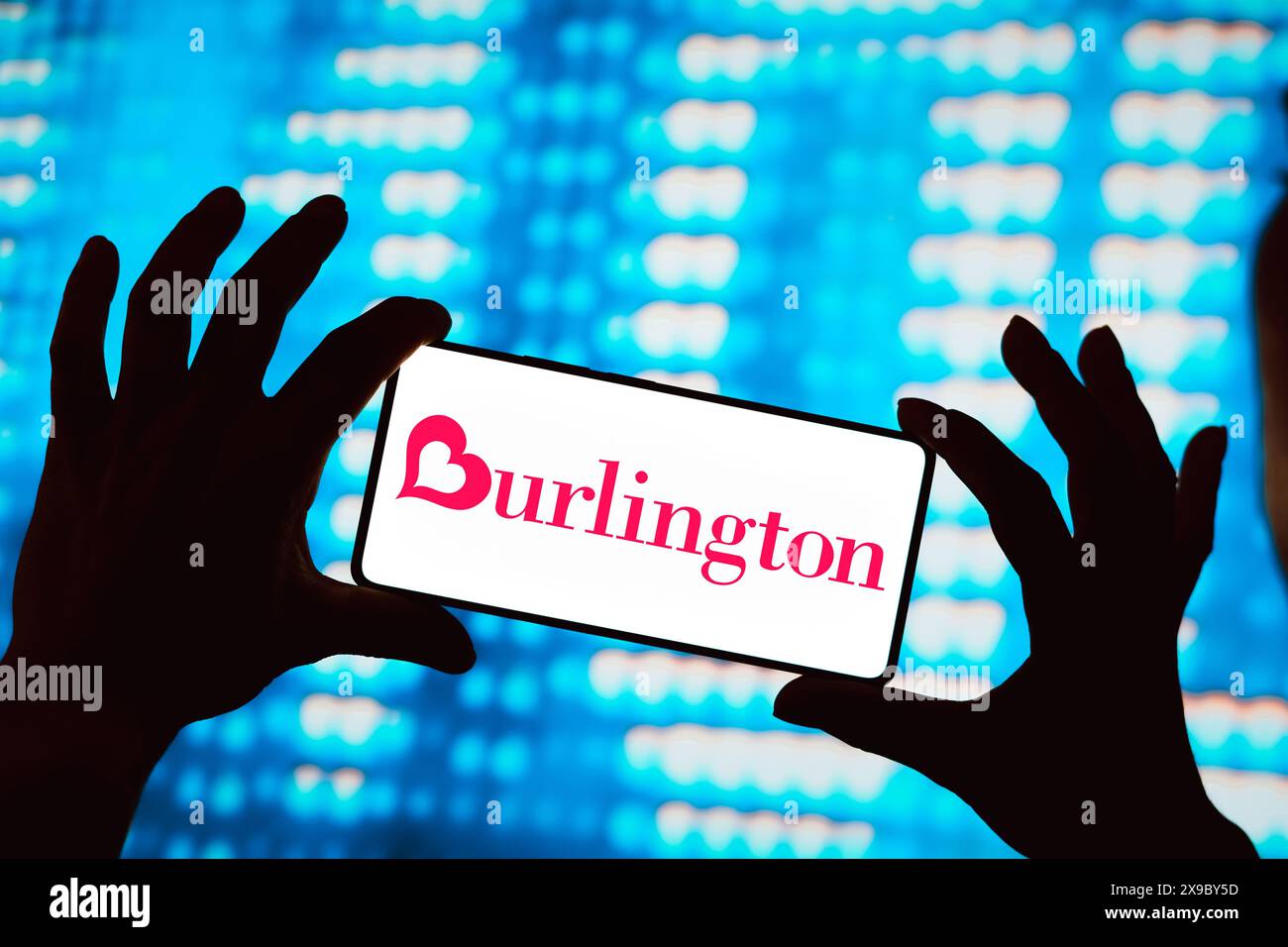 In this photo illustration, the Burlington logo is displayed on a ...