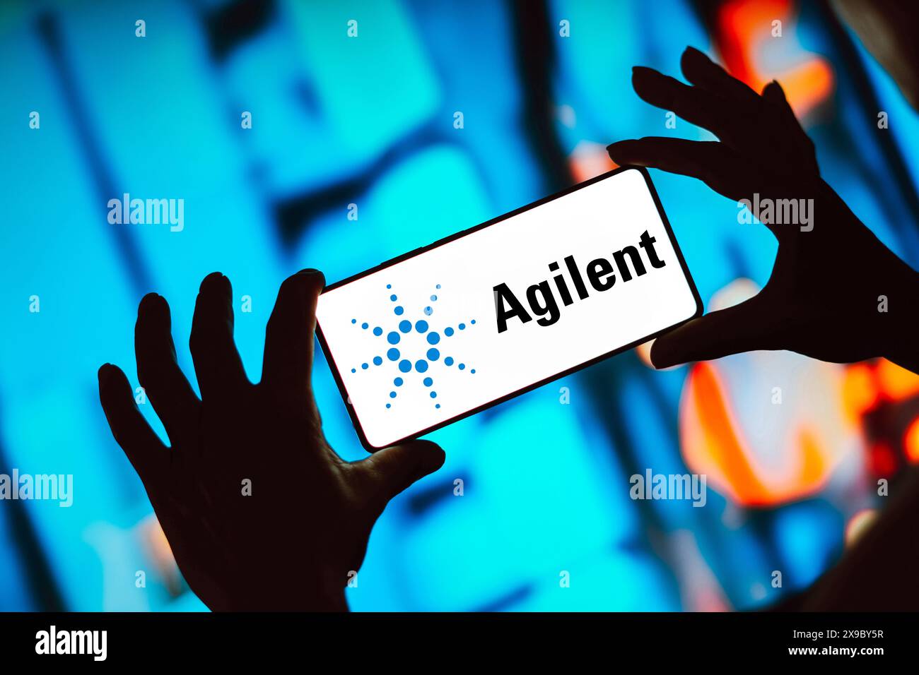 In this photo illustration, the Agilent Technologies logo is displayed ...
