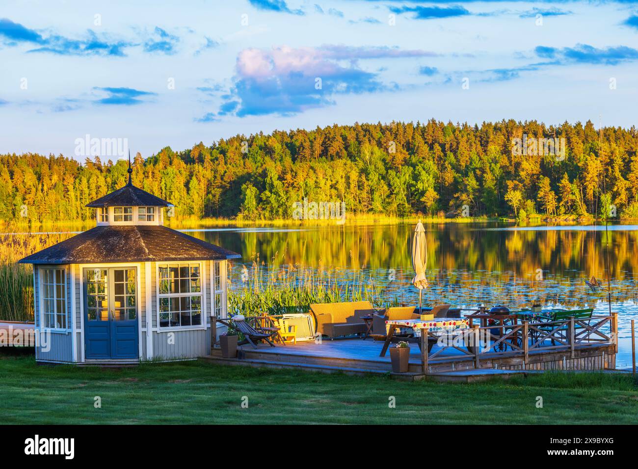 Beautiful view of a lakeside gazebo and deck with outdoor furniture ...
