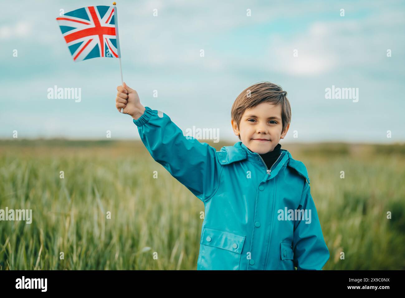 Little boy,cute british patriot kid waving Union Jack flag on nature ...