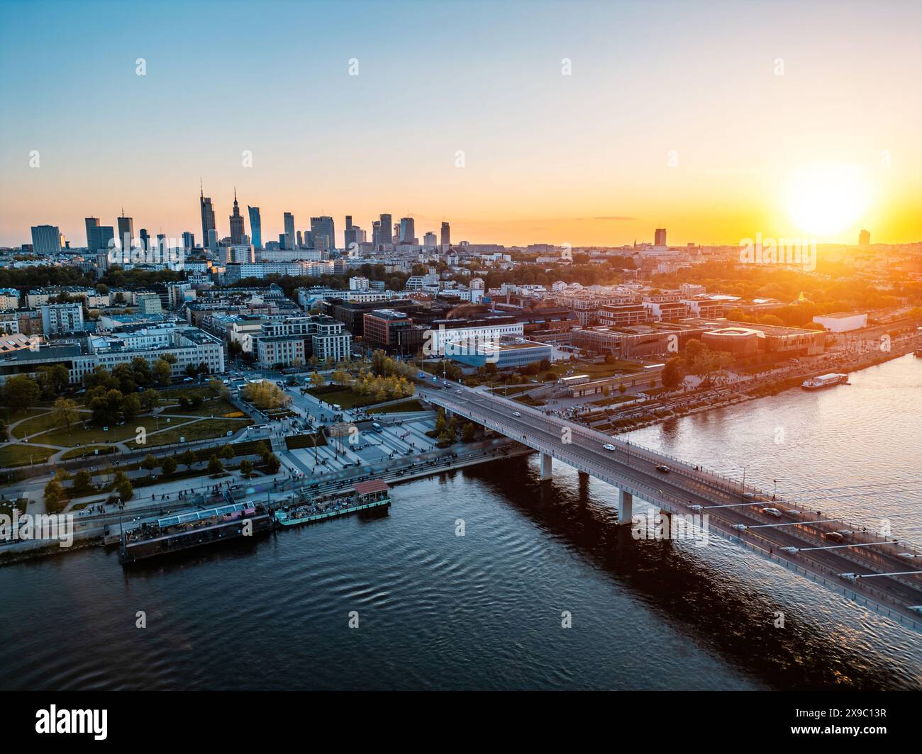 panorama of Warsaw city skyline and Vistula river at sunset ...