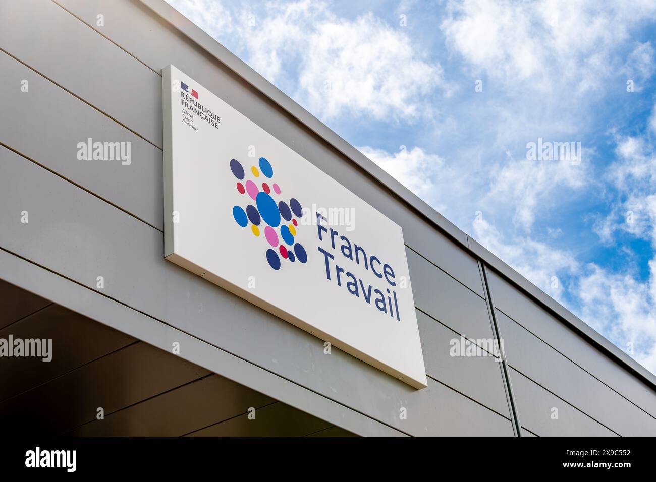 Sign and logo at the entrance to a France Travail agency. France ...