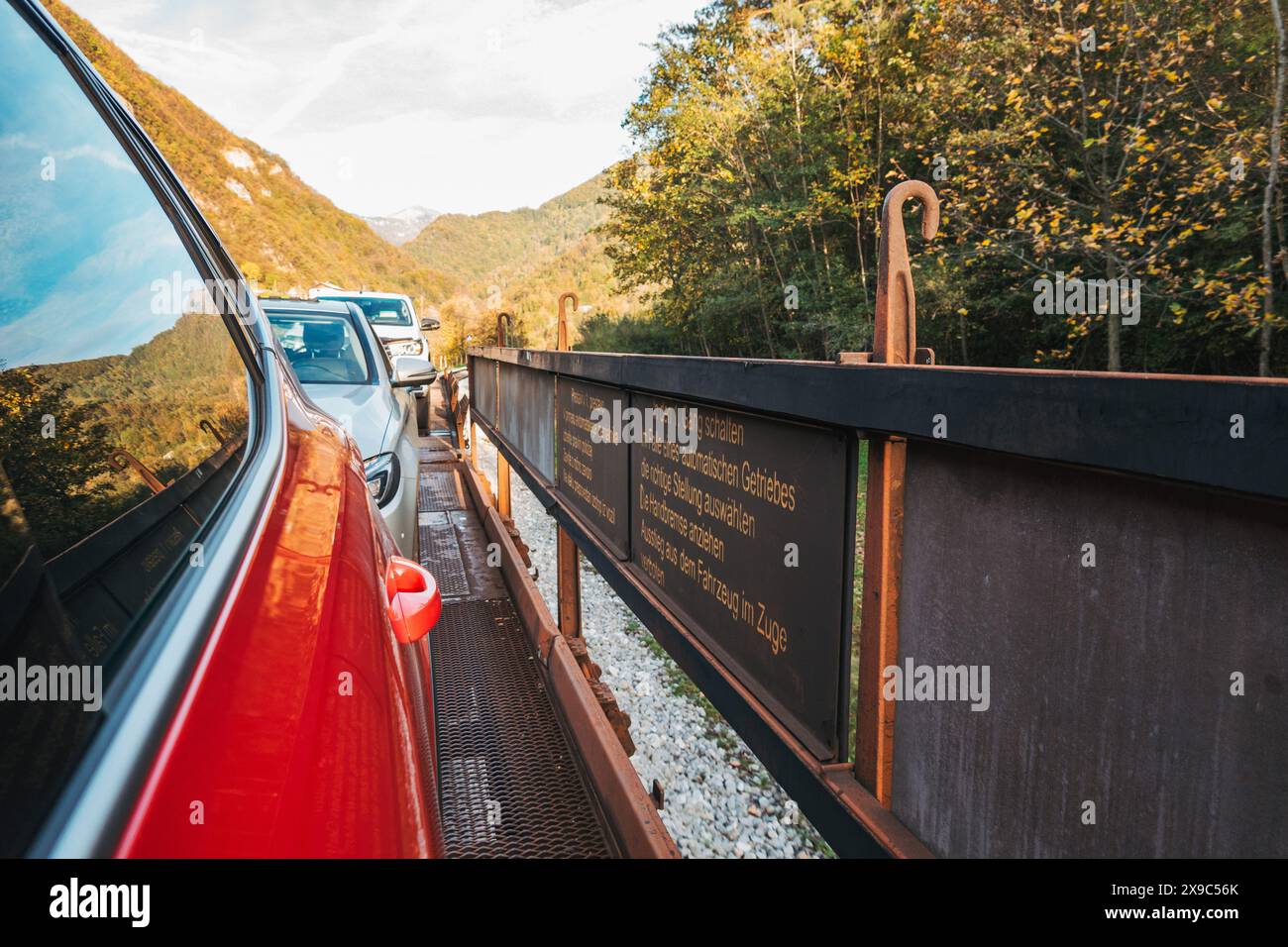 cars traveling on a motorail flatbed rail carriage down a mountain in Slovenia Stock Photo - Alamy