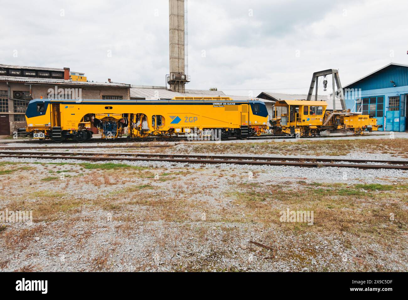 a ZGP Unimat 08-4x4/4S railway track tamping machine on tracks in a ...