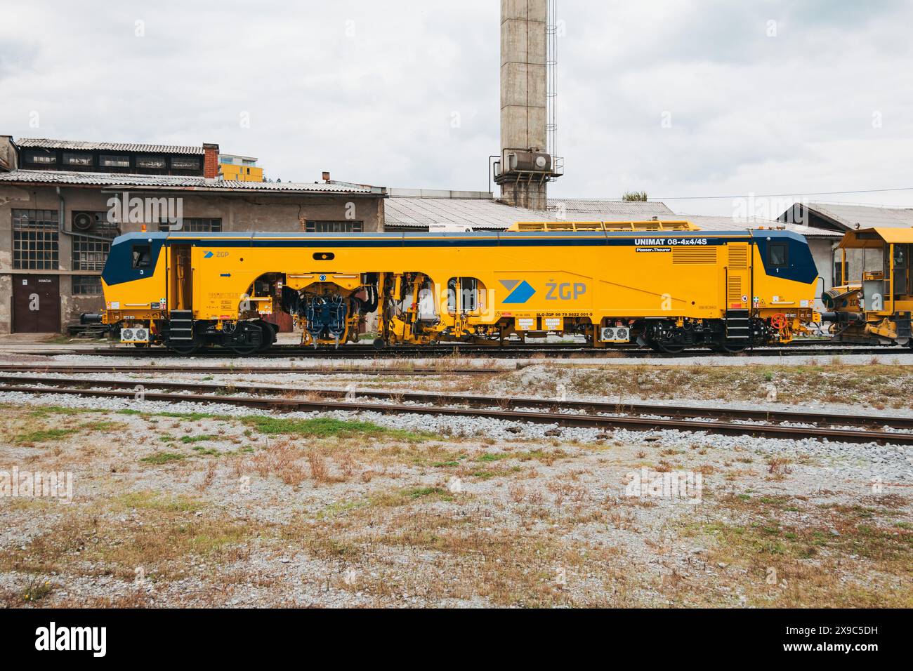 a ZGP Unimat 08-4x4/4S railway track tamping machine on tracks in a ...