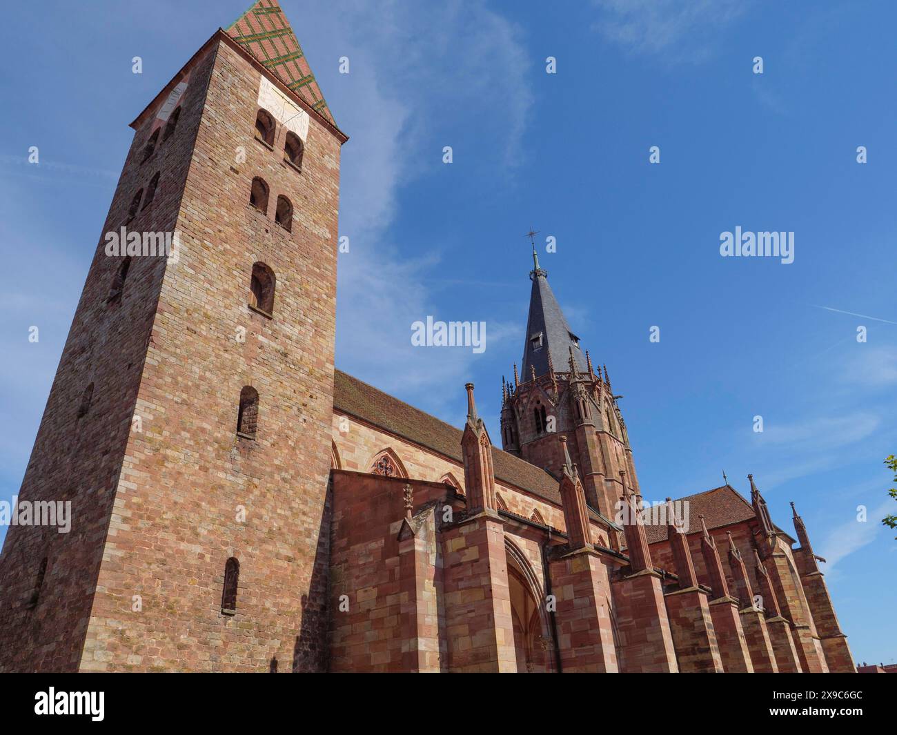 Side view of a Gothic church with several high towers under a cloudless ...