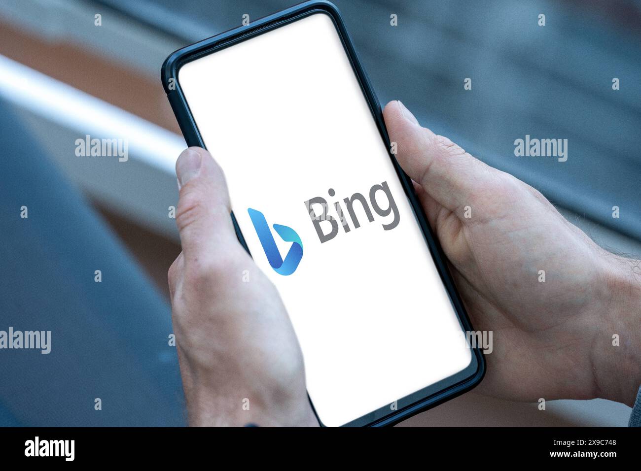 May 30, 2024: Mobile phone or smartphone in the hand of a man who opens ...